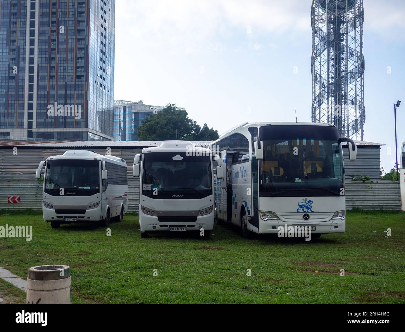 Batumi, Georgia. 08.13.2023 Buses parked on the grass. Tourist ...