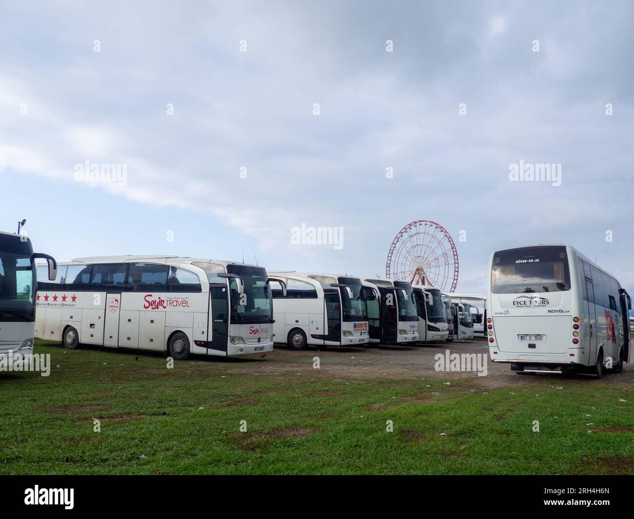 Batumi, Georgia. 08.13.2023 Buses parked on the grass. Tourist ...