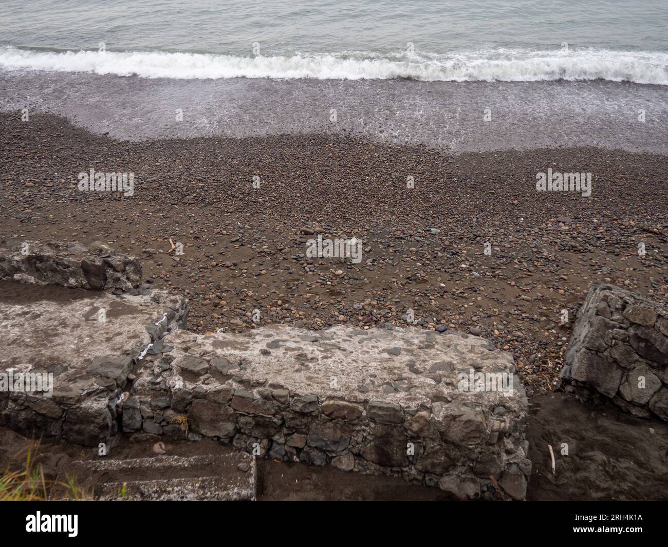 Old blocks of fortifications of the coast. Concrete structures on the ...