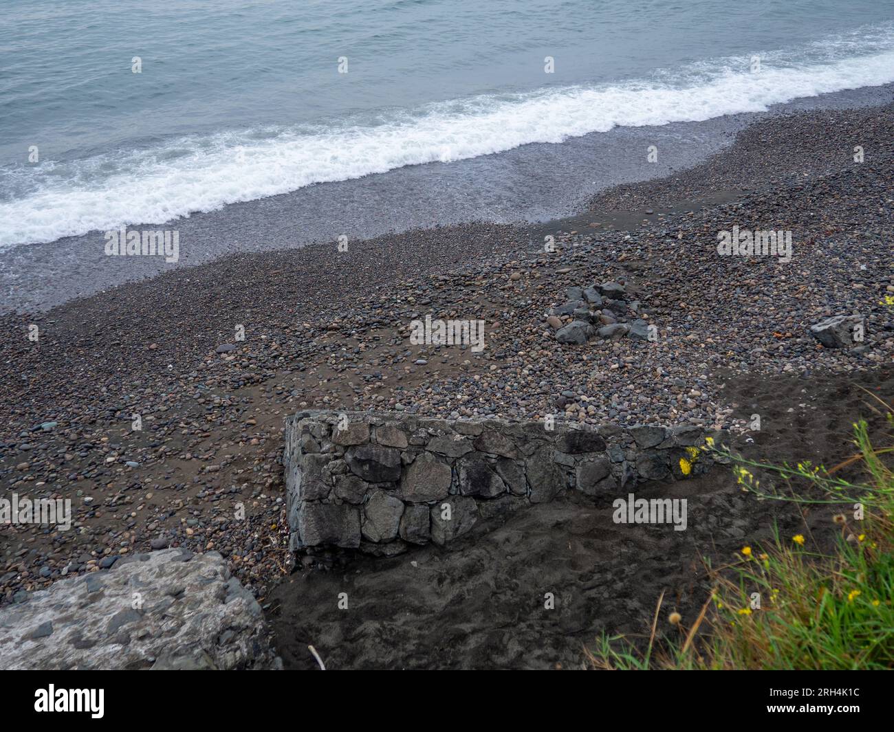 Old blocks of fortifications of the coast. Concrete structures on the ...