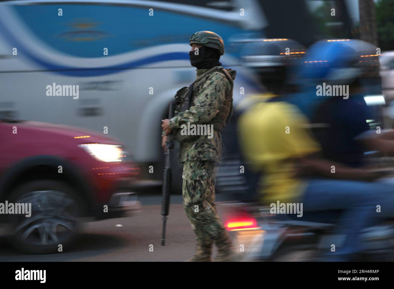 FILE - A soldier monitors vehicle traffic on the National Unity Bridge ...