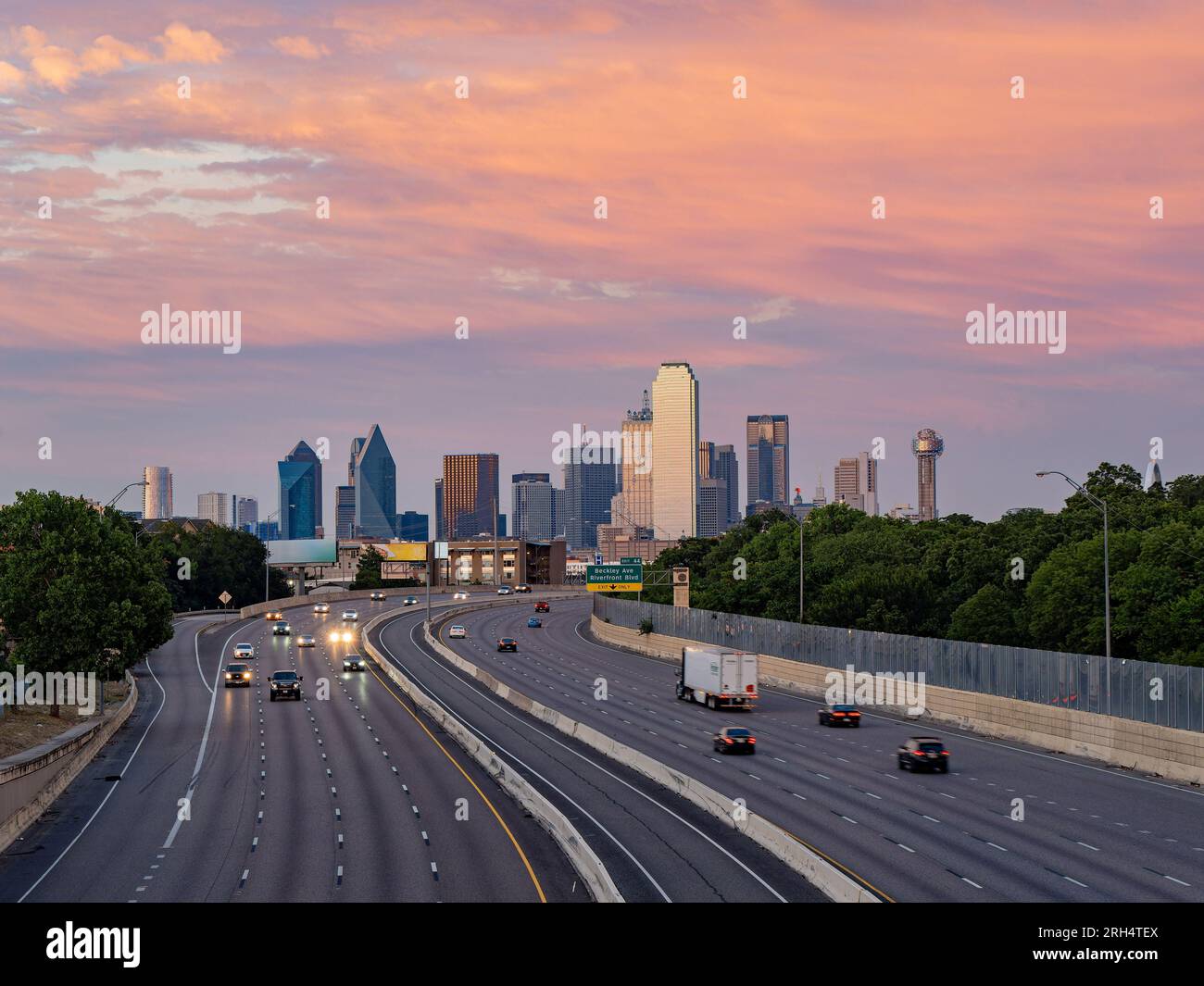 Sunset Dallas skyline with highway at Texas Stock Photo - Alamy