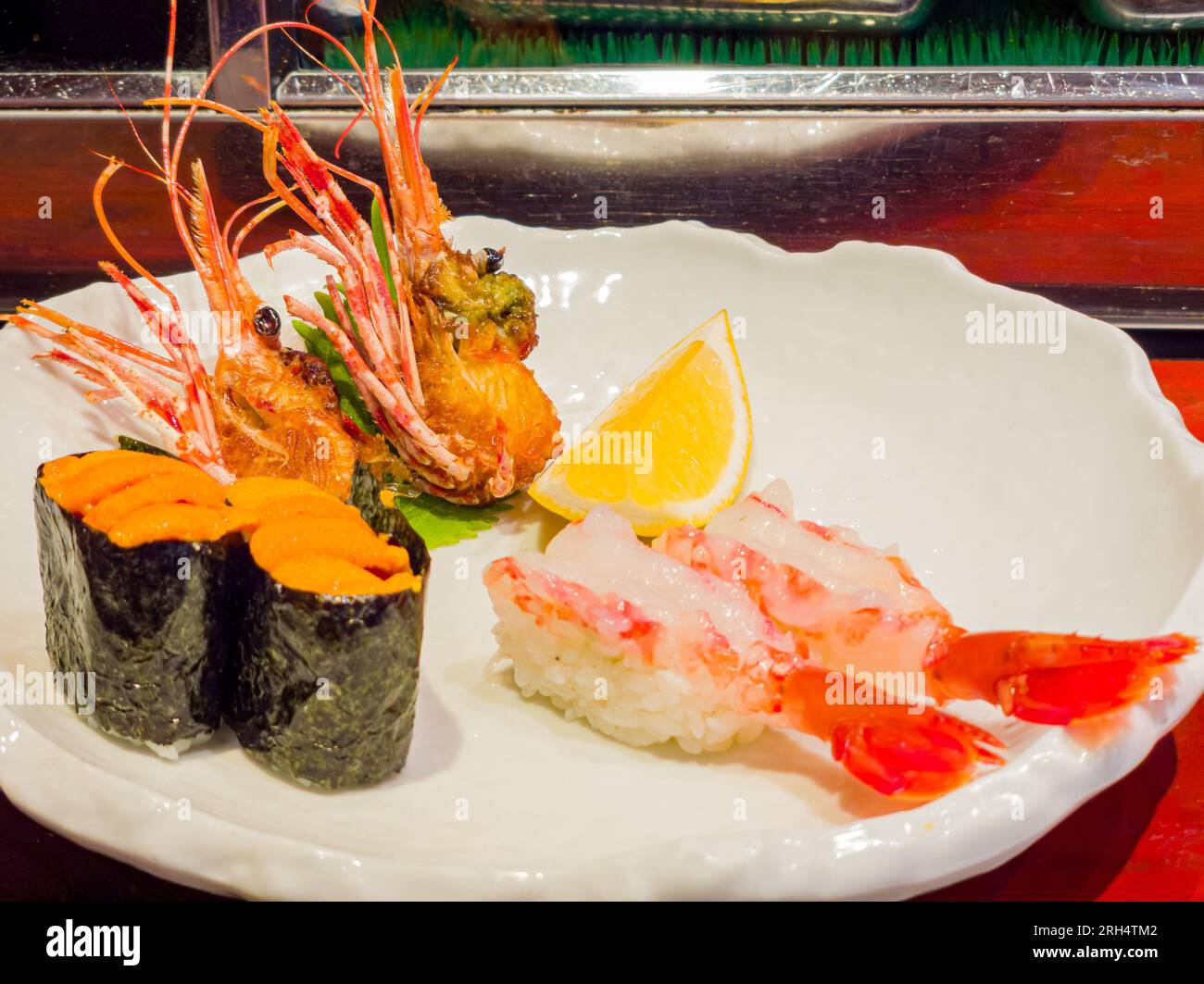 Close up shot of shrimp sushi and uni sushi at Texas Stock Photo - Alamy