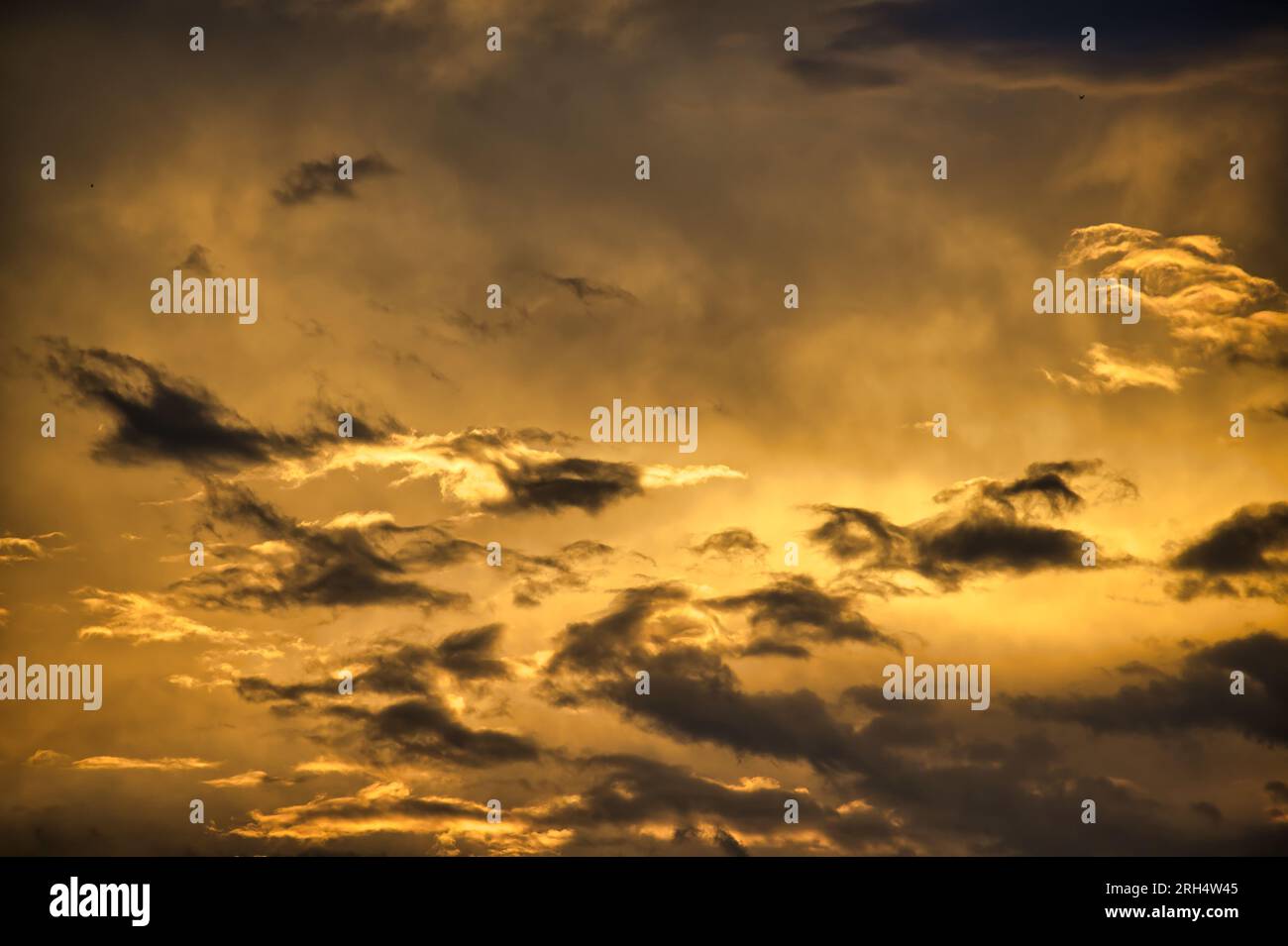 The sun's rays permeate through the clouds creating an afterglow that ...