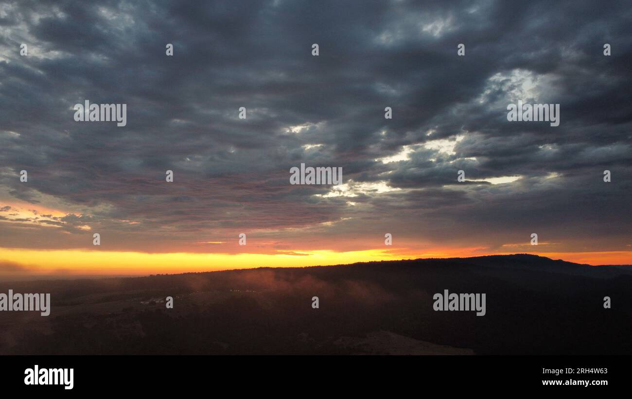 Sunset With Beautiful Clouds and Hills Stock Photo - Alamy