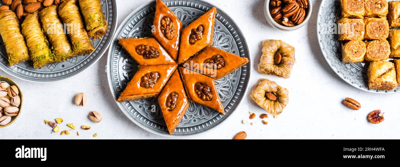 Arabian Baklava with nuts and honey on white background, banner ...