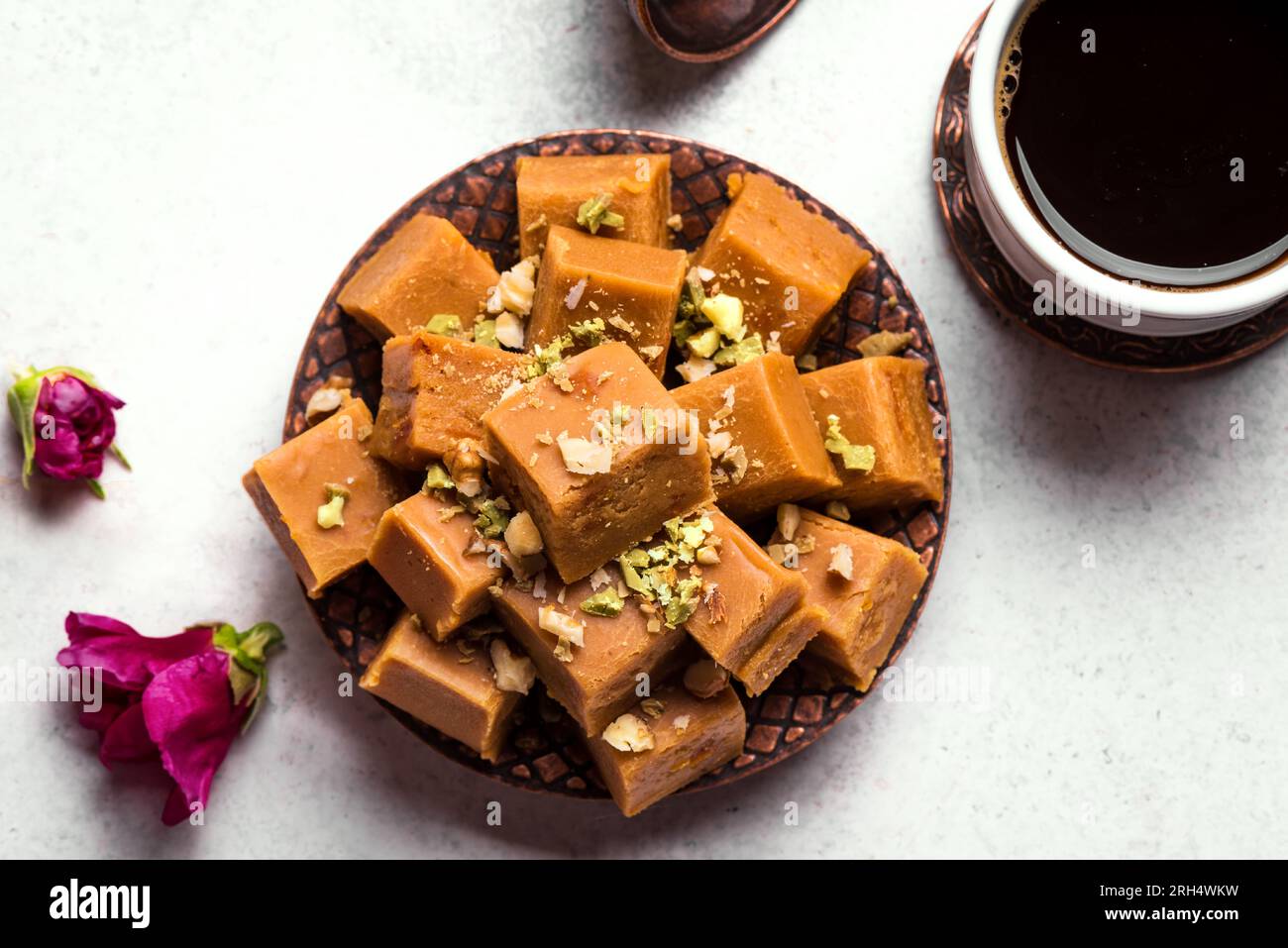 Caramel sherbet with pistachious nuts and turkish coffee on white ...