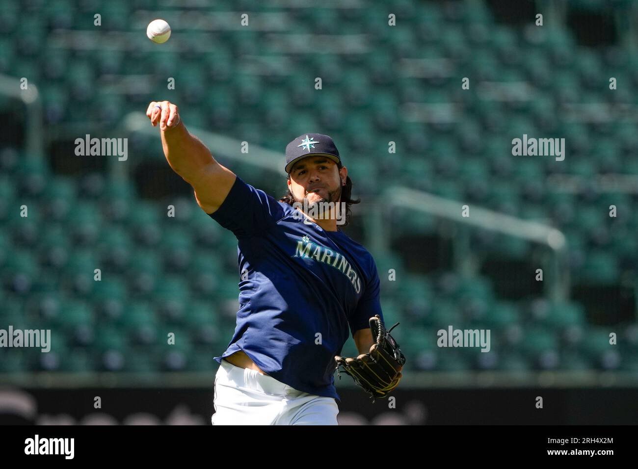 Seattle Mariners' Eugenio Suarez throws the ball before a baseball game ...