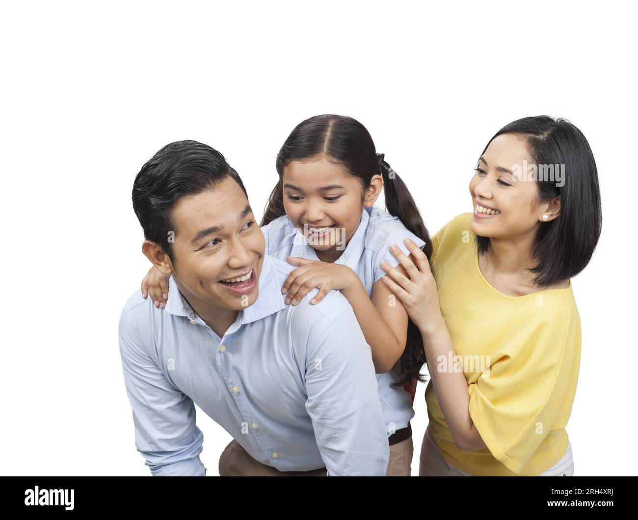 Studio portrait of an Asian family with happy smiles, captured against ...
