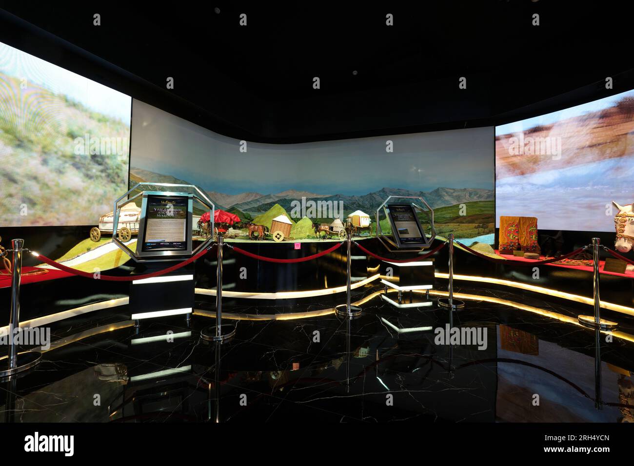 A display of a model of nomadic life with horses pulling tents, yurts ...