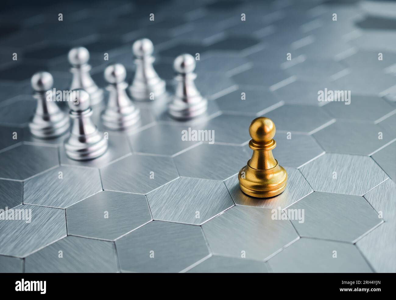The golden pawn chess piece standing out from the group of silver pawn ...