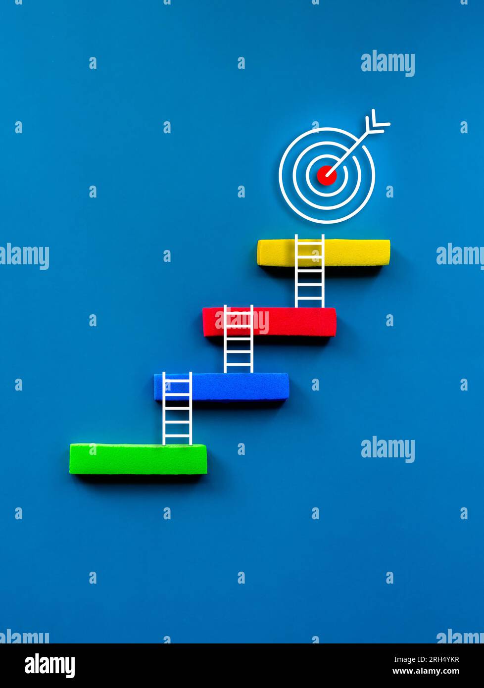 Big target icon on top of colorful puzzle blocks as a bar graph chart ...