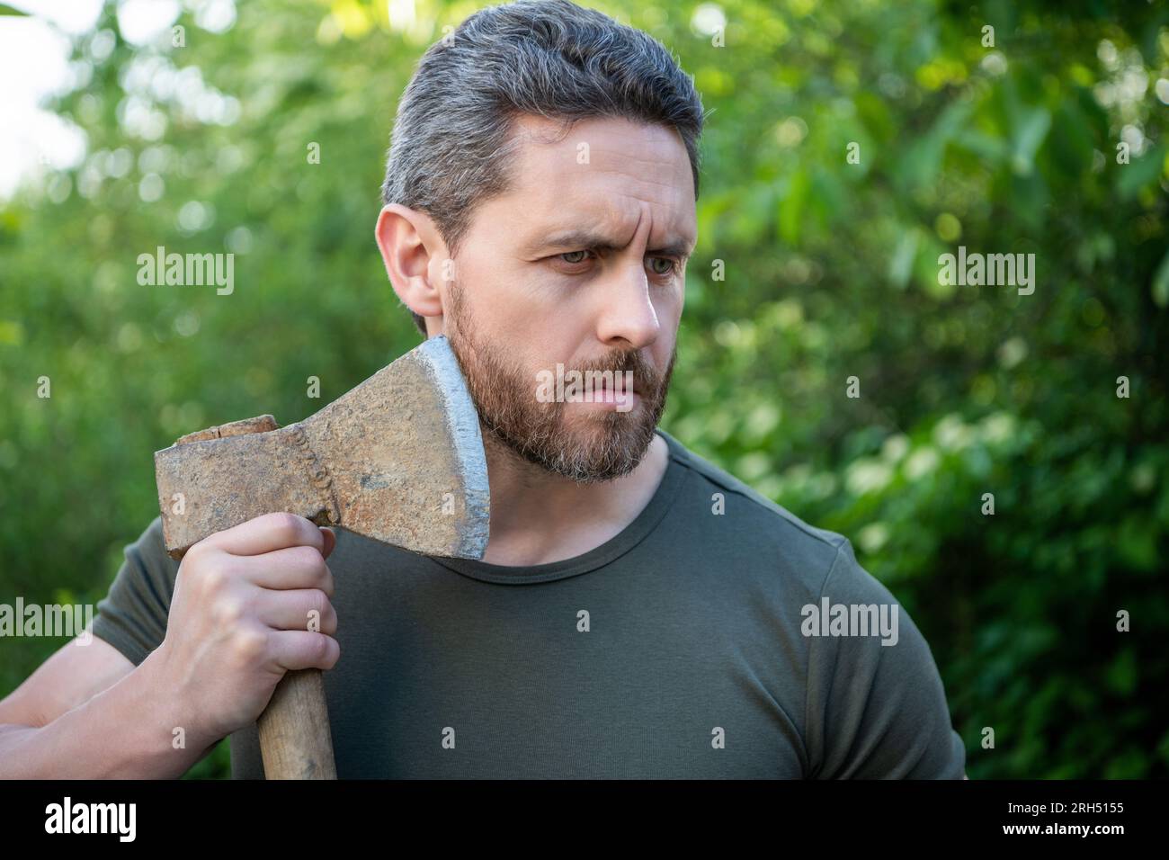 masculine guy holding axe. bearded masculine guy with axe. masculine ...