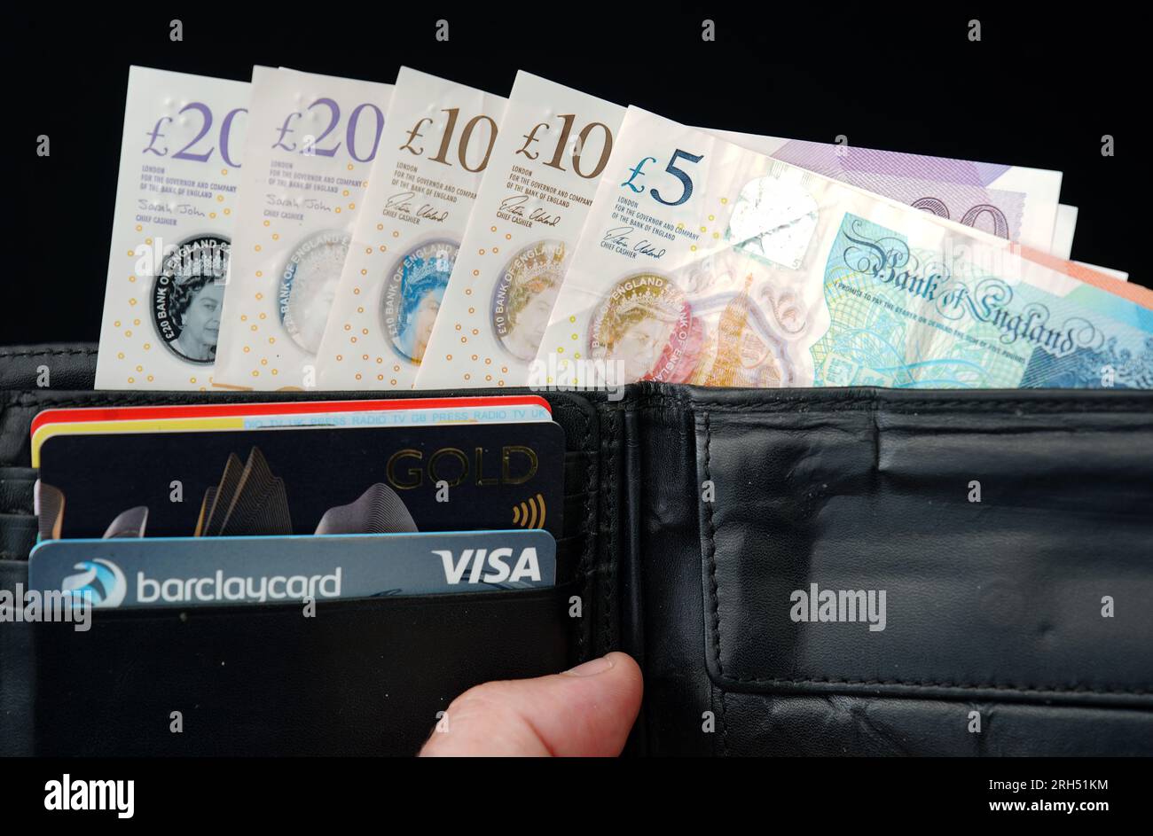 File photo dated 23/06/23 of UK £5, £10, £20 notes and credit cards ...