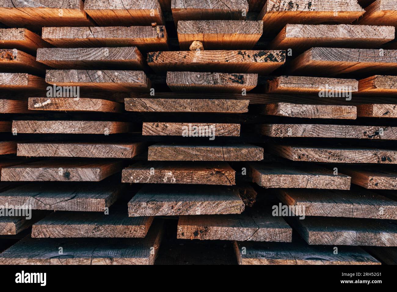 Stack of wooden planks solid-sawn timber construction material as ...