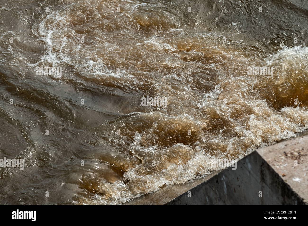 Sewage pipe outfall into the river, water pollution and environmental ...