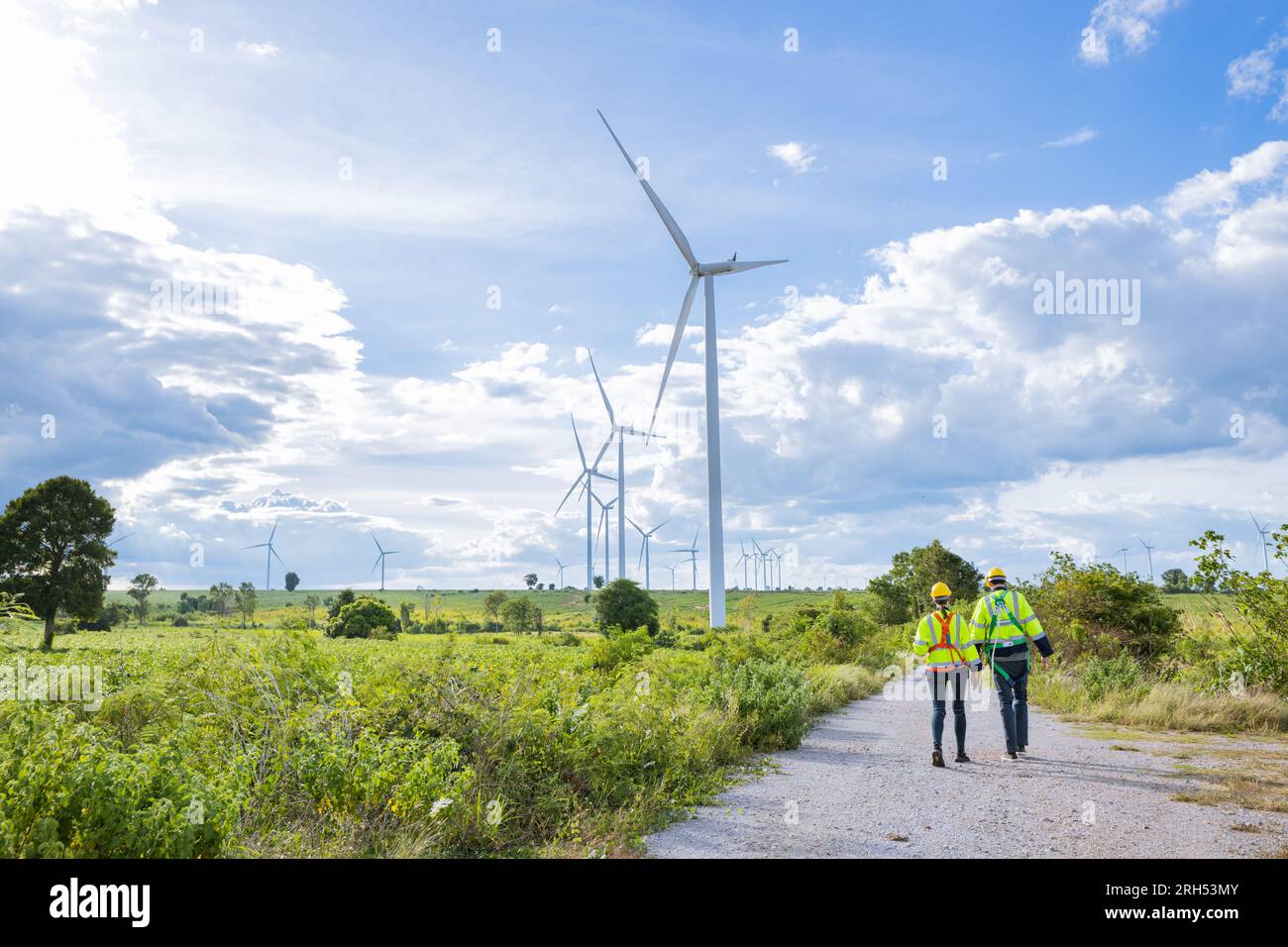 Back view of engineers service team working maintenance wind turbine ...