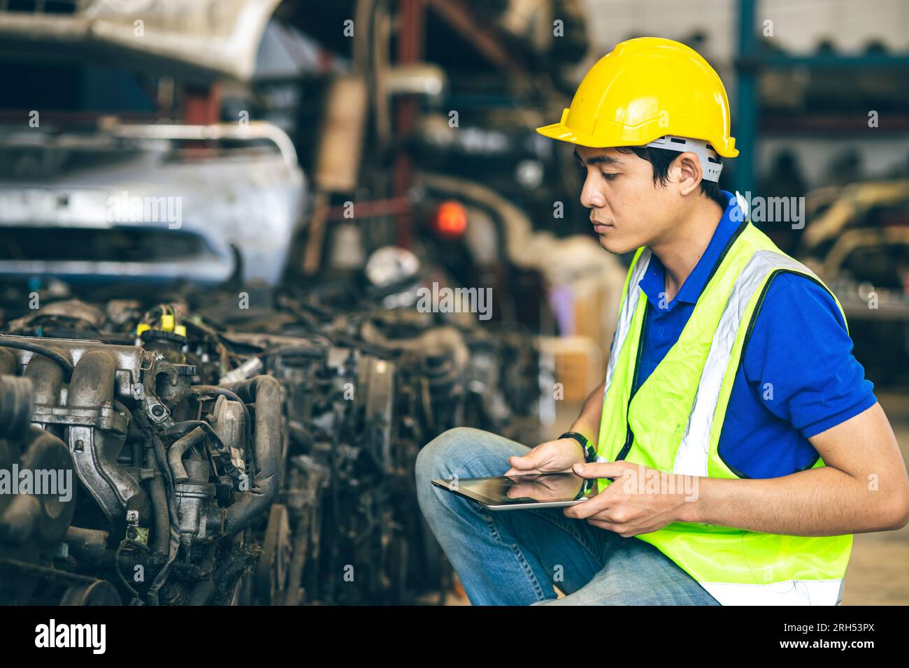 Engineer male worker check inventory store old used auto spare part ...