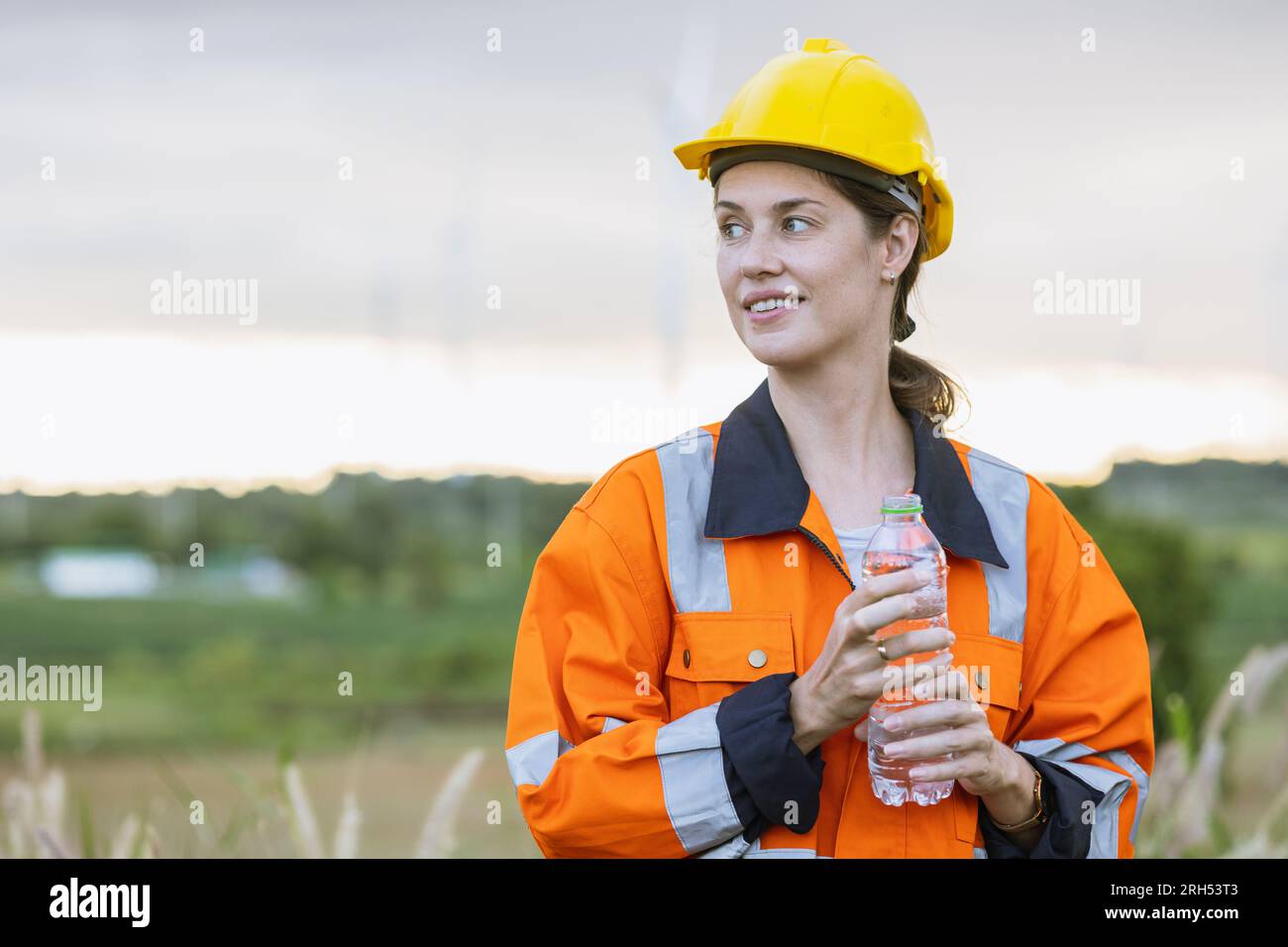 Engineer woman technician standing relax rest drinking clean water ...