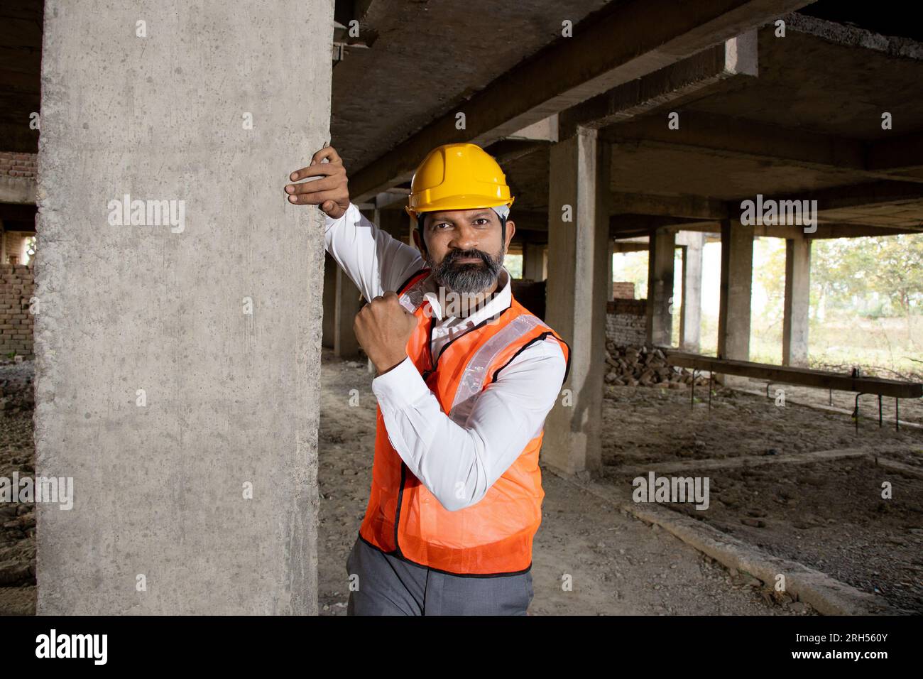 Portrait of confident young Indian male civil engineer or architect ...