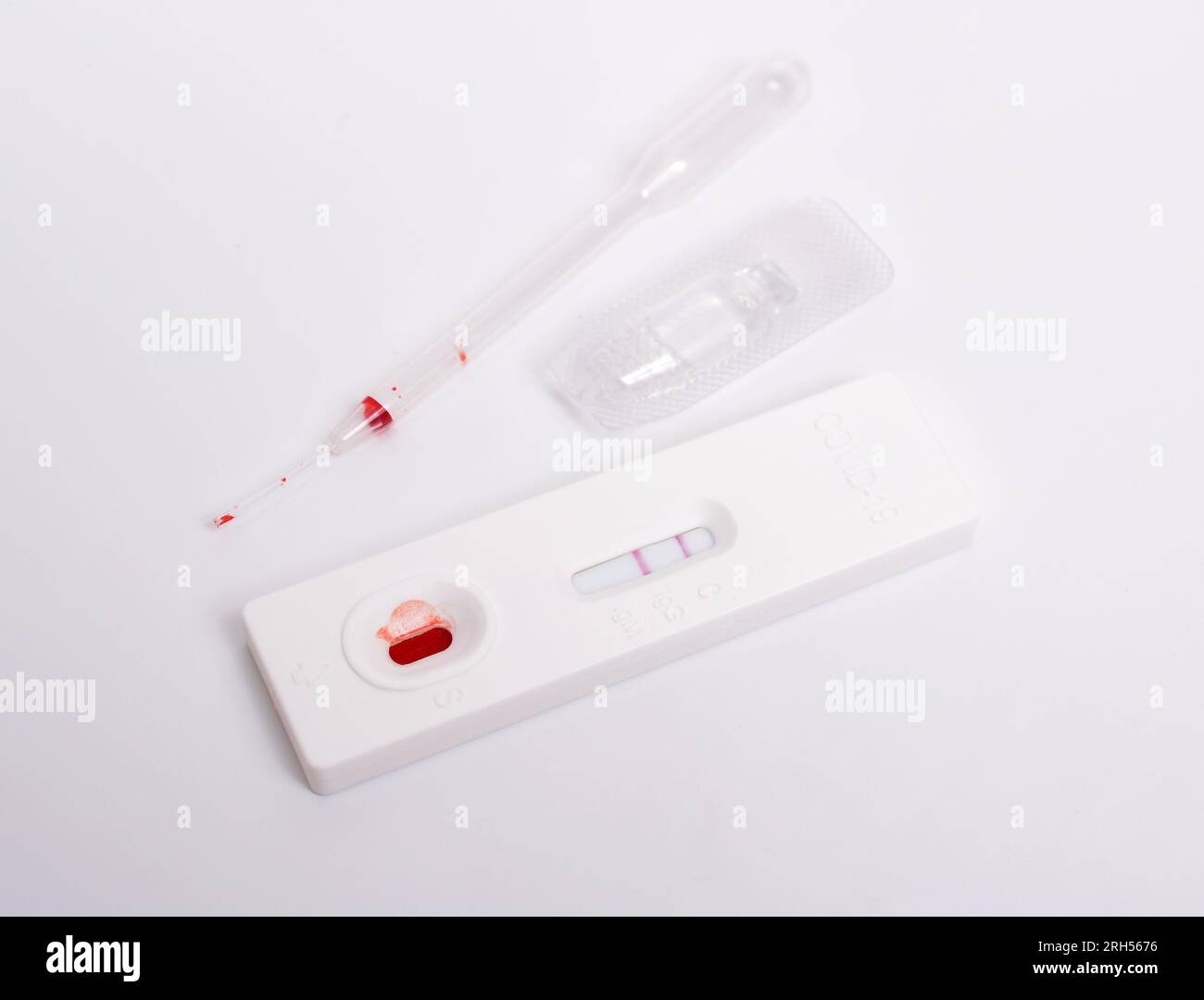 SARS COV 2 Antigen rapid test. Used, positive. On white background ...