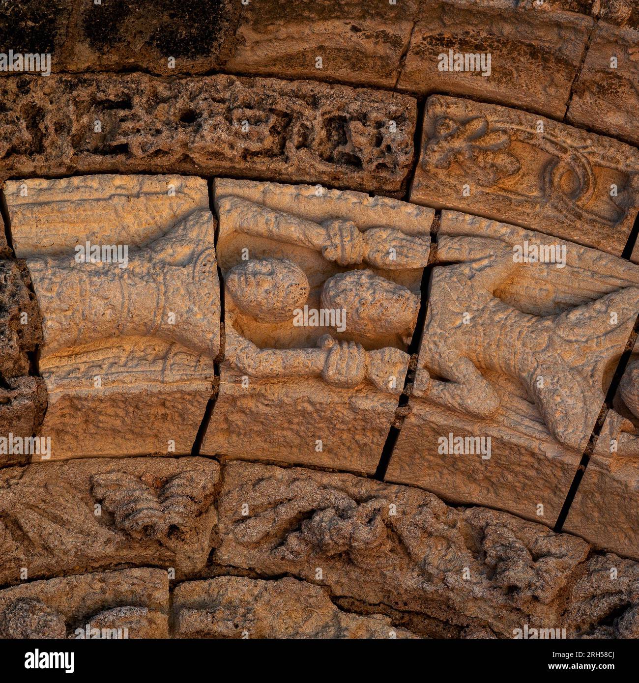 Two acrobats, part of a human chain. The acrobat on the right grasps ...