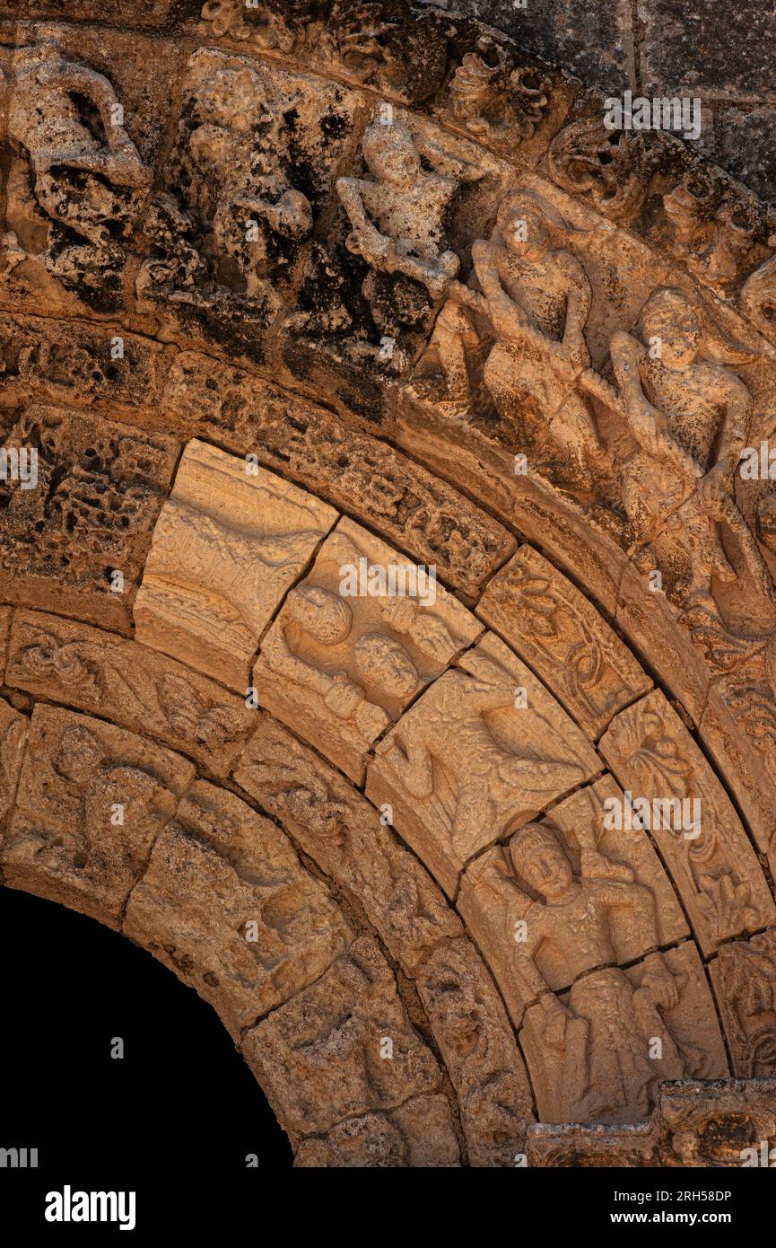Men pulling a rope. Detail of eroded Romanesque sculpture, église ...