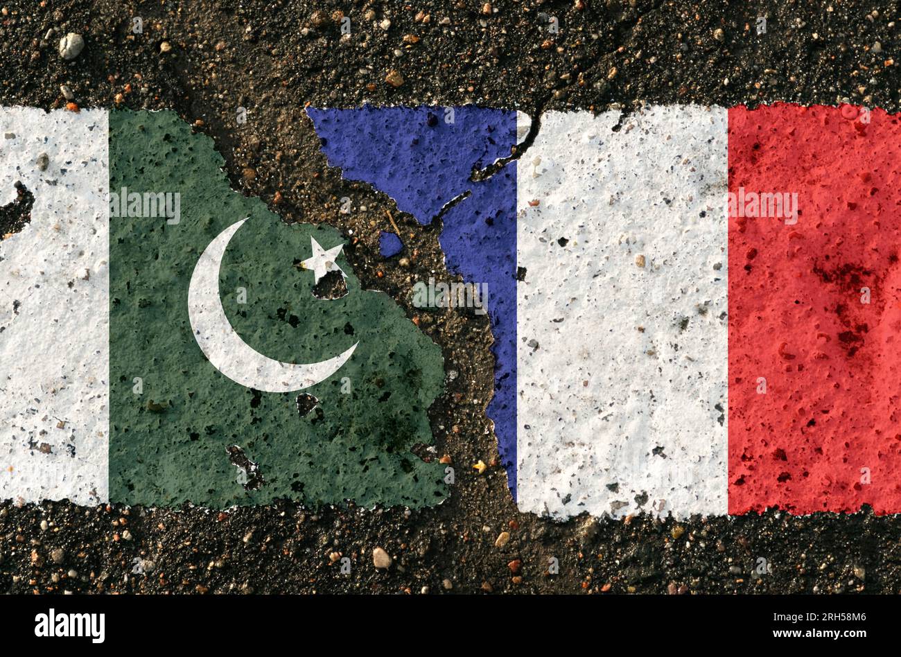 On the pavement are images of the flags of Pakistan and France, as a ...