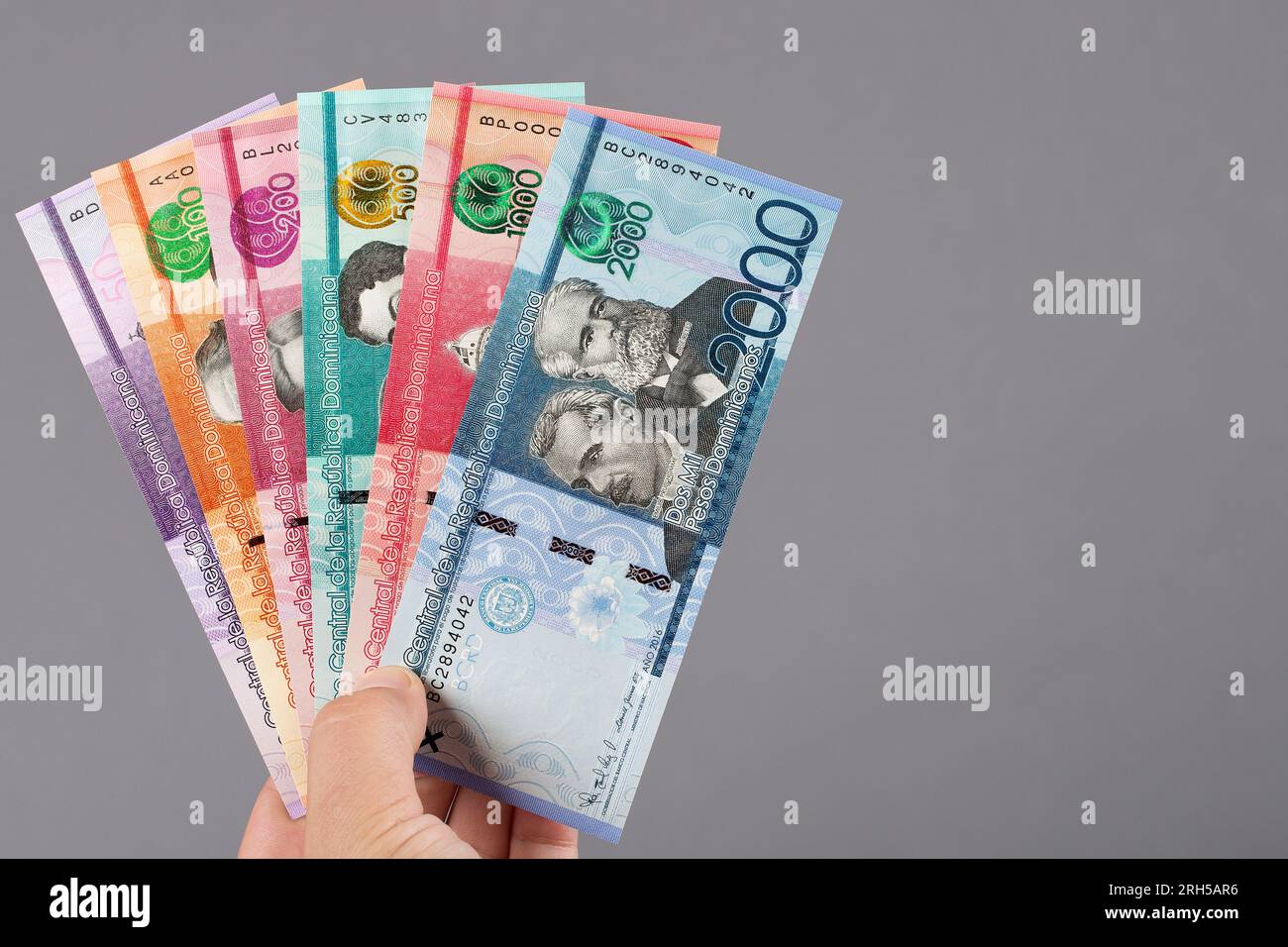 Hand on banknote hi-res stock photography and images - Alamy