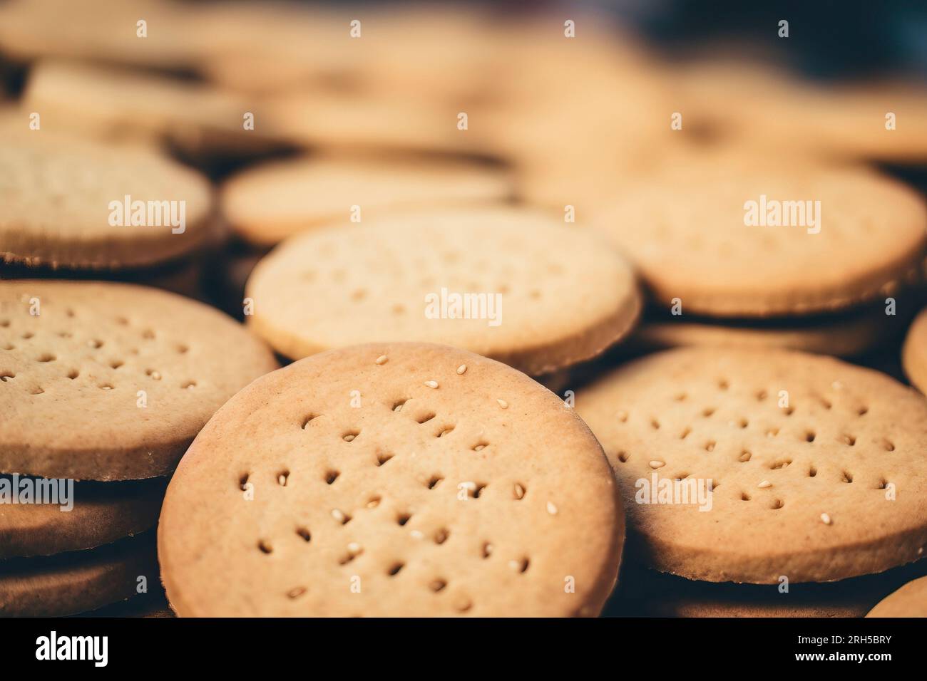 A cozy scene with delicious homemade biscuits displayed on a rustic ...