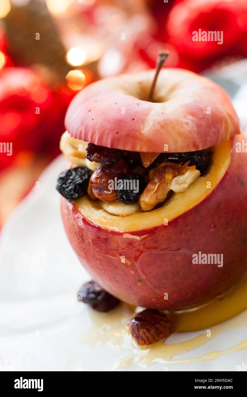 Baked apple stuffed with nuts and dried fruits Stock Photo - Alamy