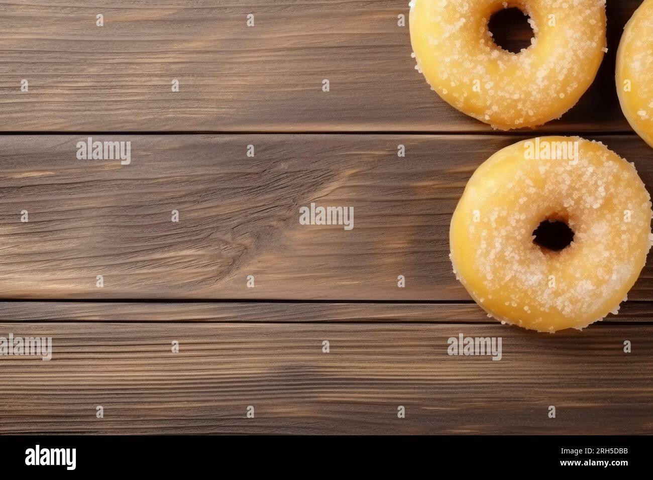 Overhead shot of colorful donuts arranged on a rustic backdrop, with ...