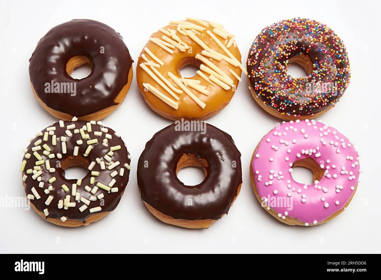 Colorful donuts showcased in a delicious array against a pristine white ...