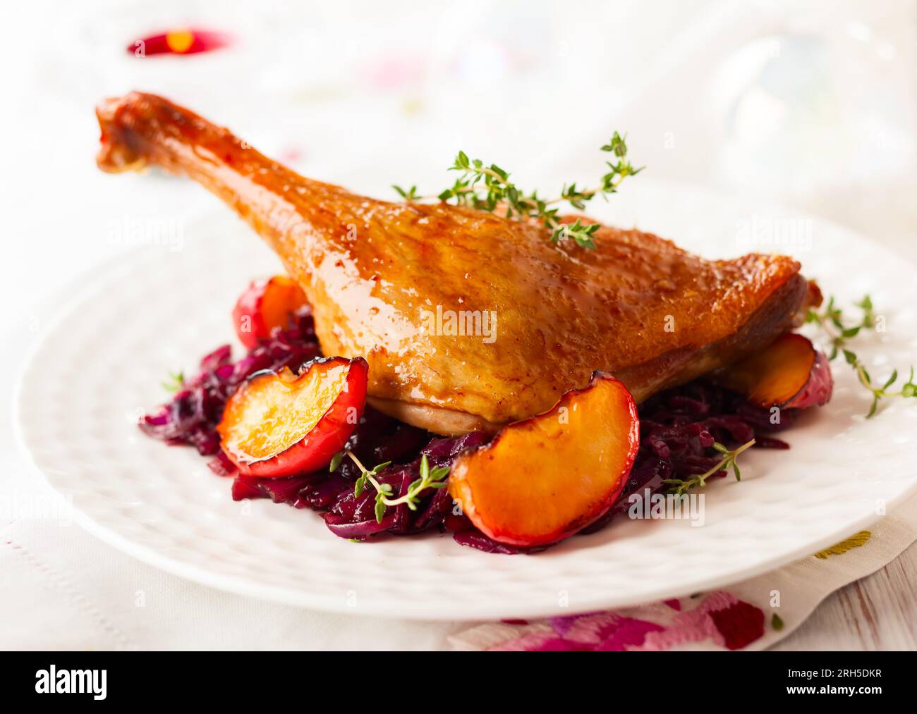 Roasted duck leg with red cabbage and apples for Christmas Stock Photo ...