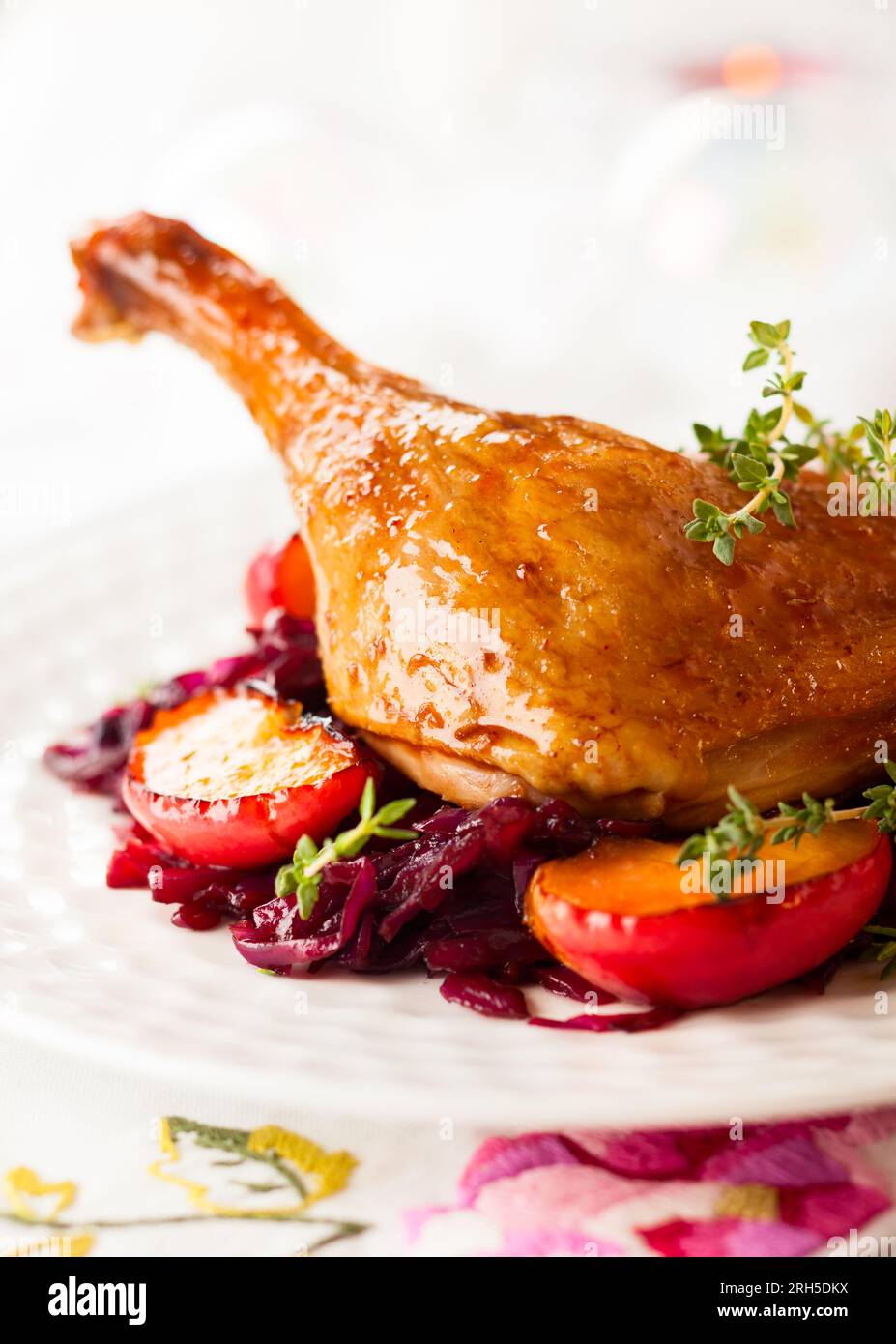 Roasted duck leg with red cabbage and apples for Christmas Stock Photo ...