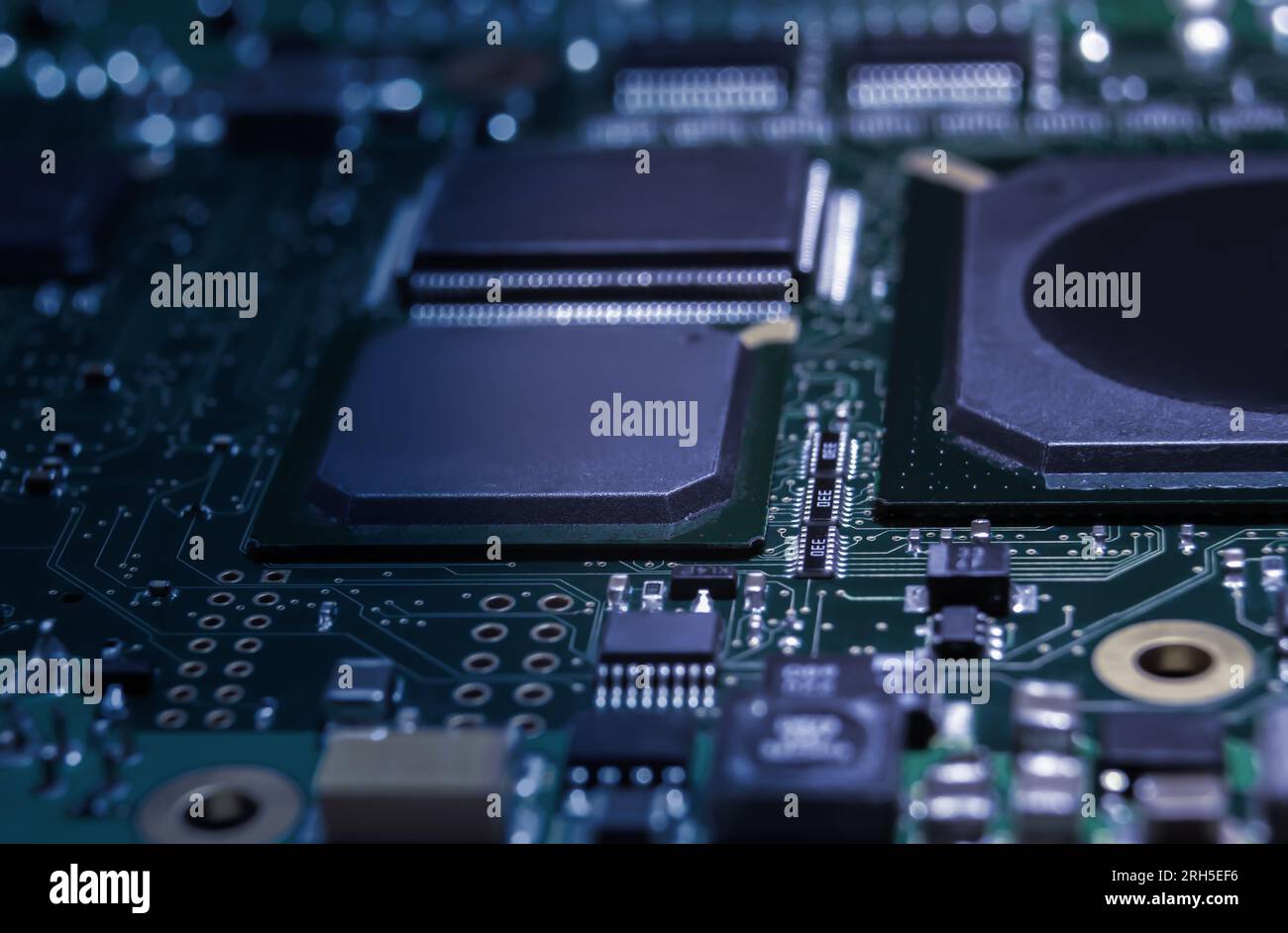 Intricate Circuit Board With Computer Hardware Showcasing Complexity Of Electronics Industry