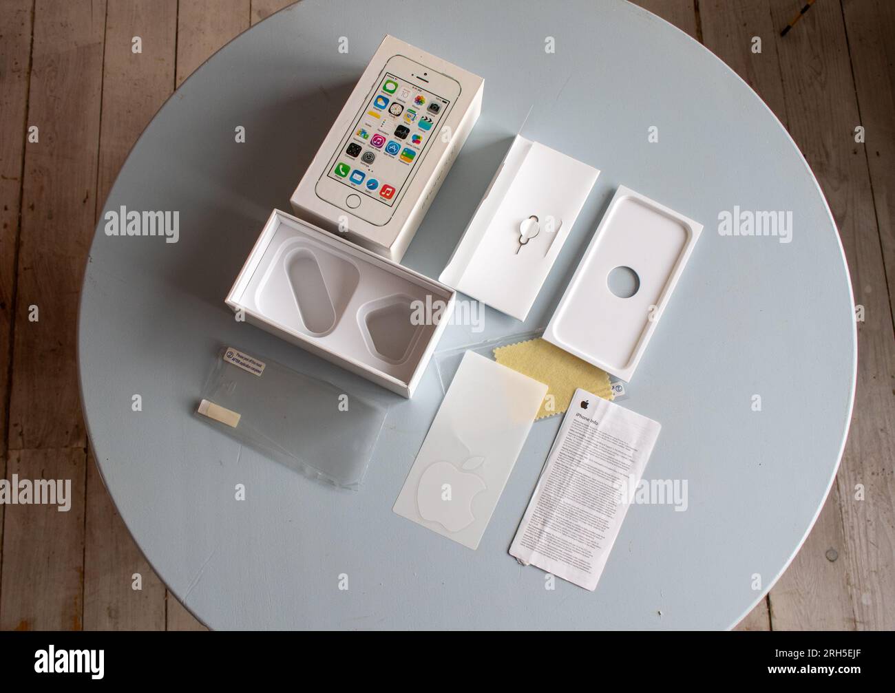 Apple iPhone 5s smartphone bits and pieces including the SIM removal ...