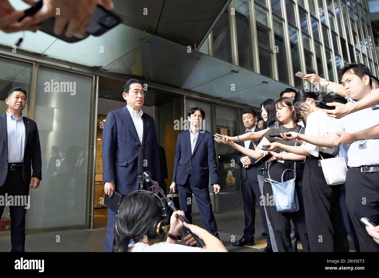 Japan's Prime Minister Fumio Kishida speaks to media after taking a large language model; LLM ...