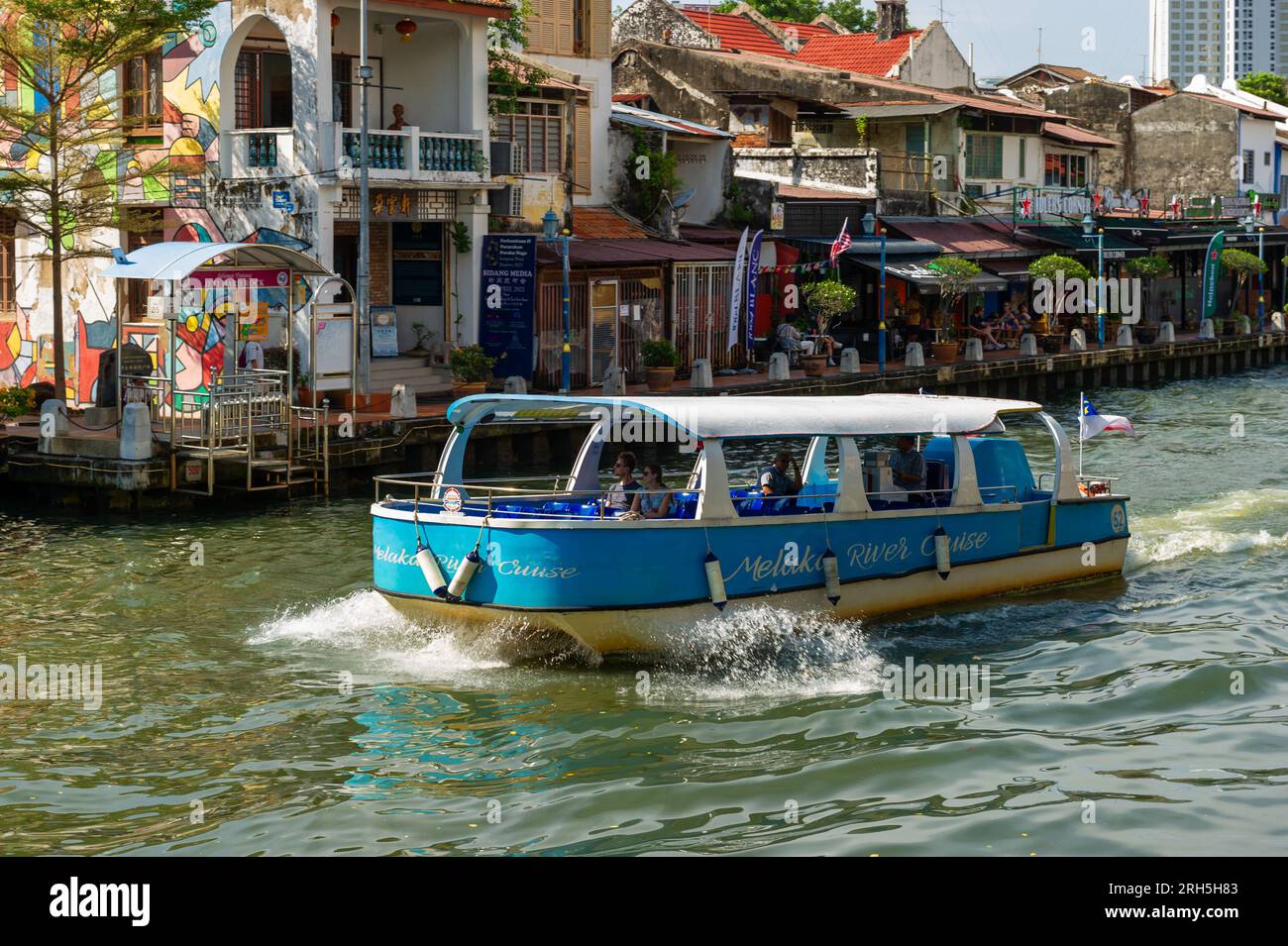 Malacca River Cruise boat sailing down the river on a sunny day Stock ...