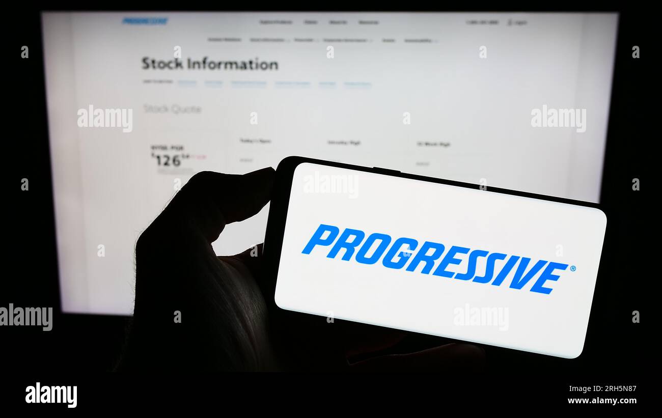 Person holding cellphone with logo of US insurance company The ...