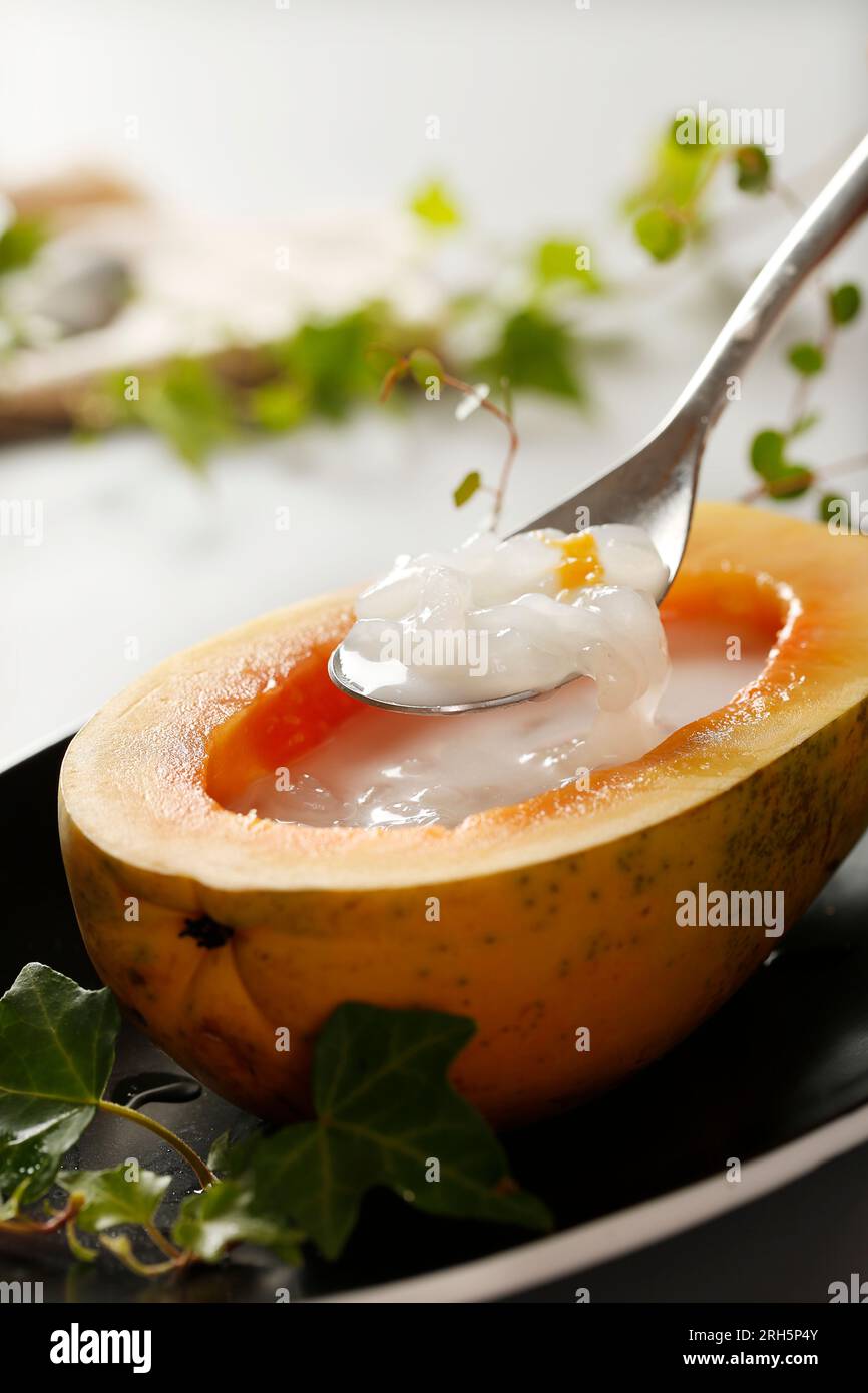 Double boiled Harsmar in Whole Papaya Stock Photo - Alamy