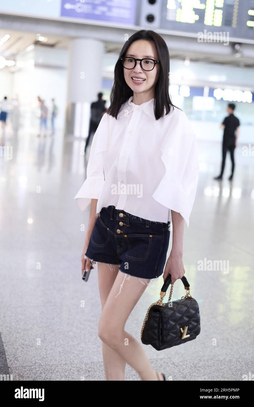 Chinese actress and dancer Dong Jie appears at the airport in Beijing ...