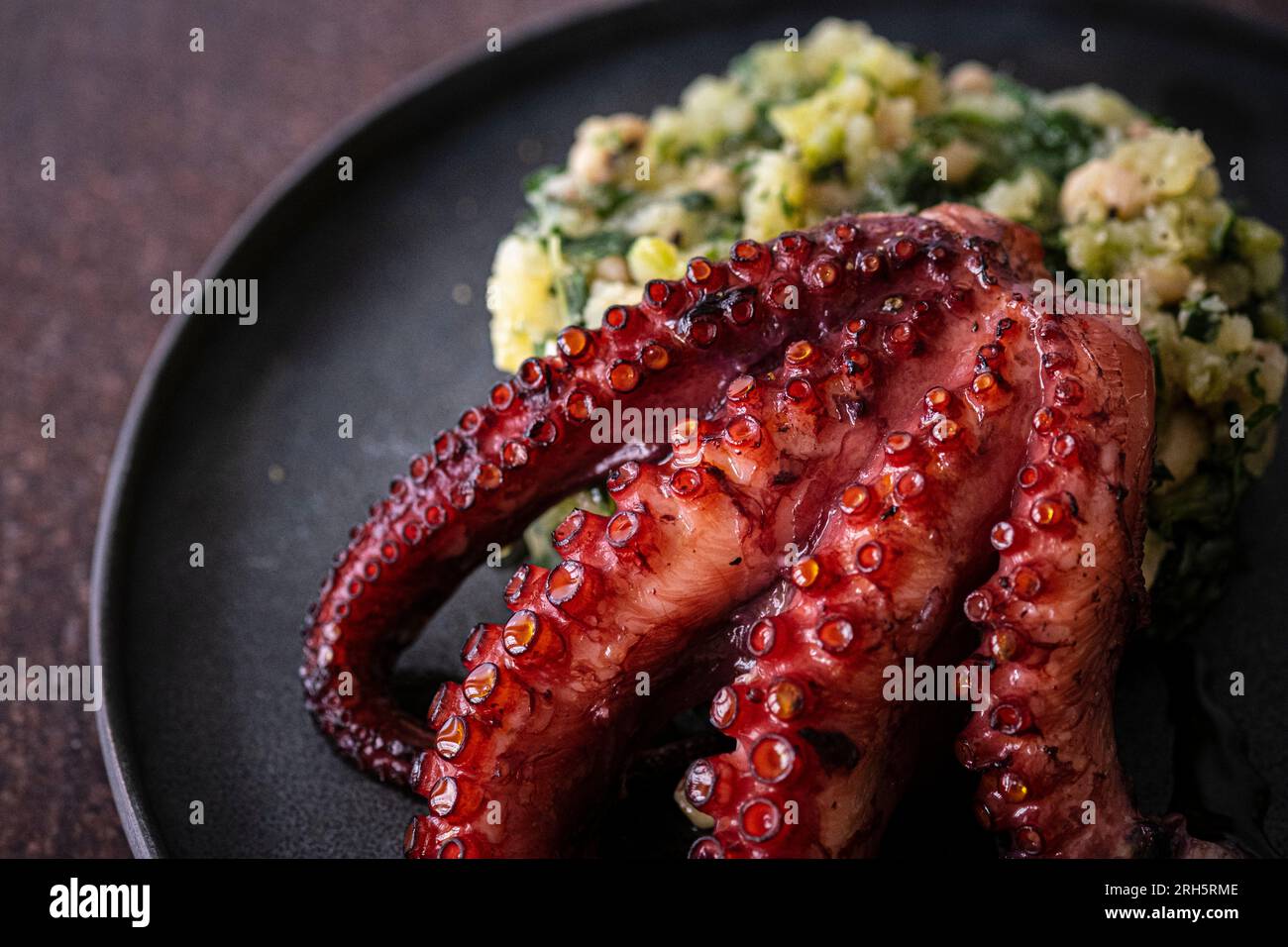 Roasted octopus. Potato, cabbage, beans Stock Photo - Alamy