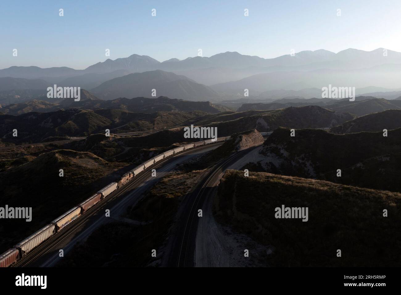 Aerial view of train in mountain landscape Stock Photo - Alamy
