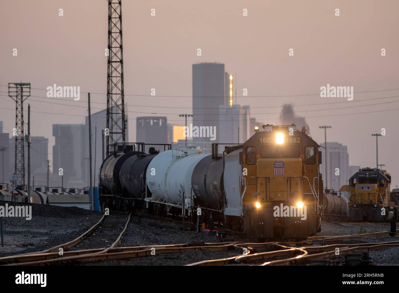 Houston skyline visible in background of train yard Stock Photo - Alamy