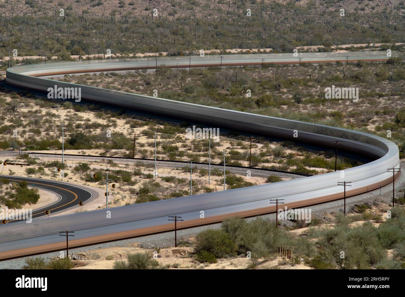 Long exposure of train snaking around curves Stock Photo - Alamy