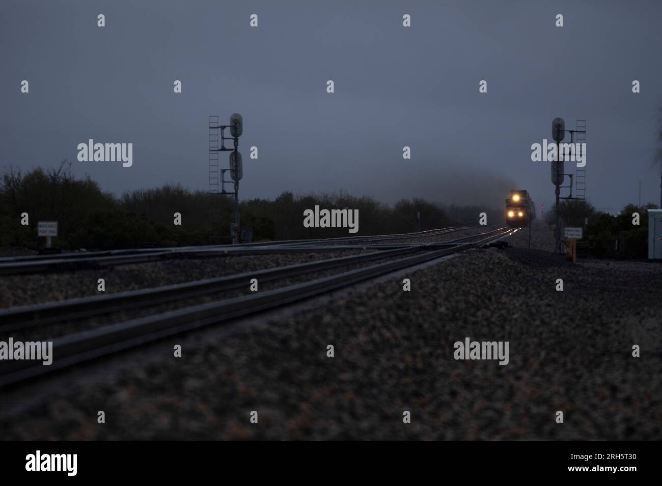 Approaching train headlight in low light environment Stock Photo - Alamy