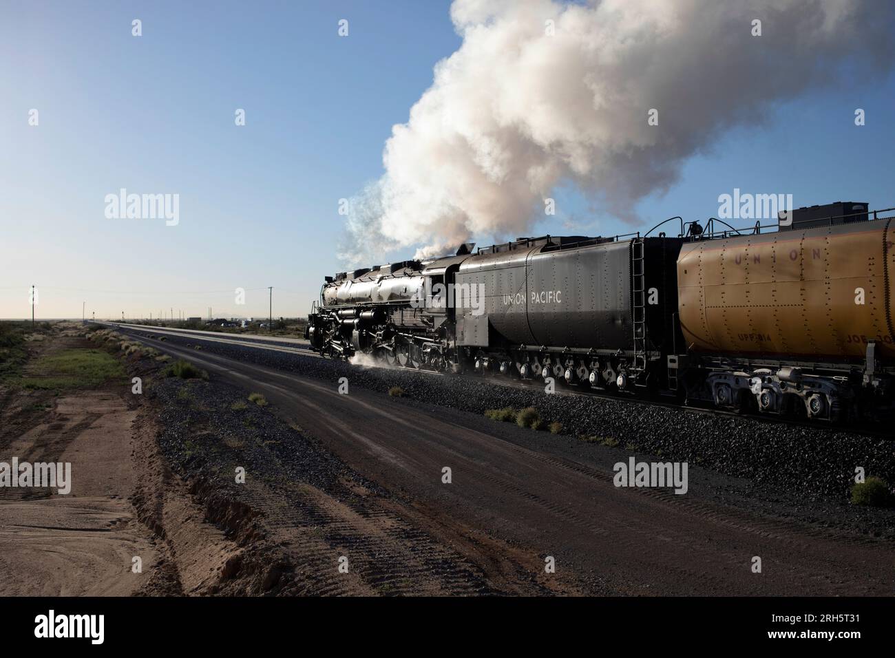 A steam locomotive bellows smoke as it moves away Stock Photo - Alamy