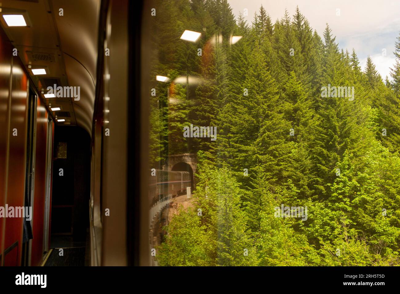Passenger train enters tunnel view from inside train Stock Photo - Alamy