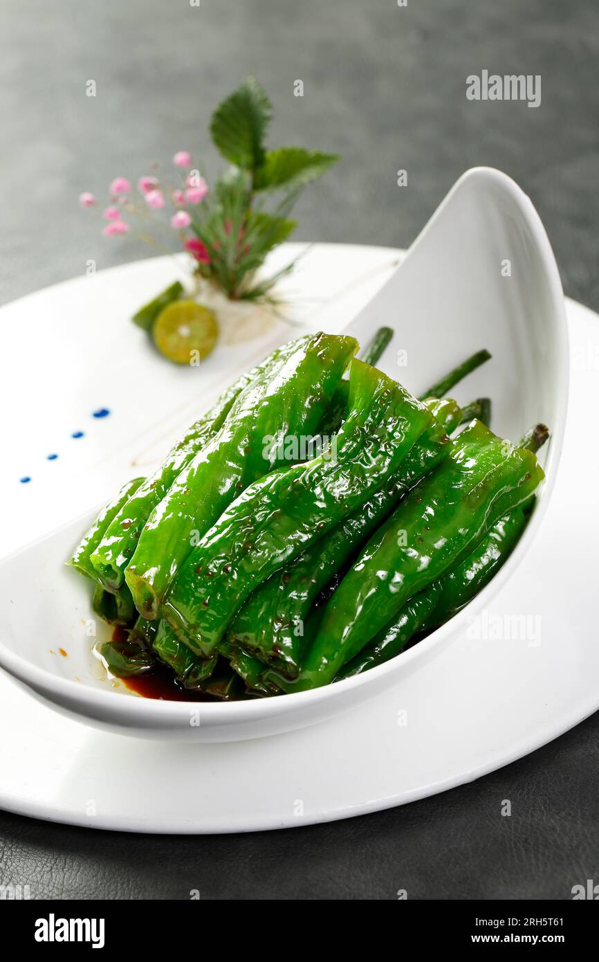 Pan-seared Green Chili Pepper，or "Tiger skin green pepper Stock Photo ...